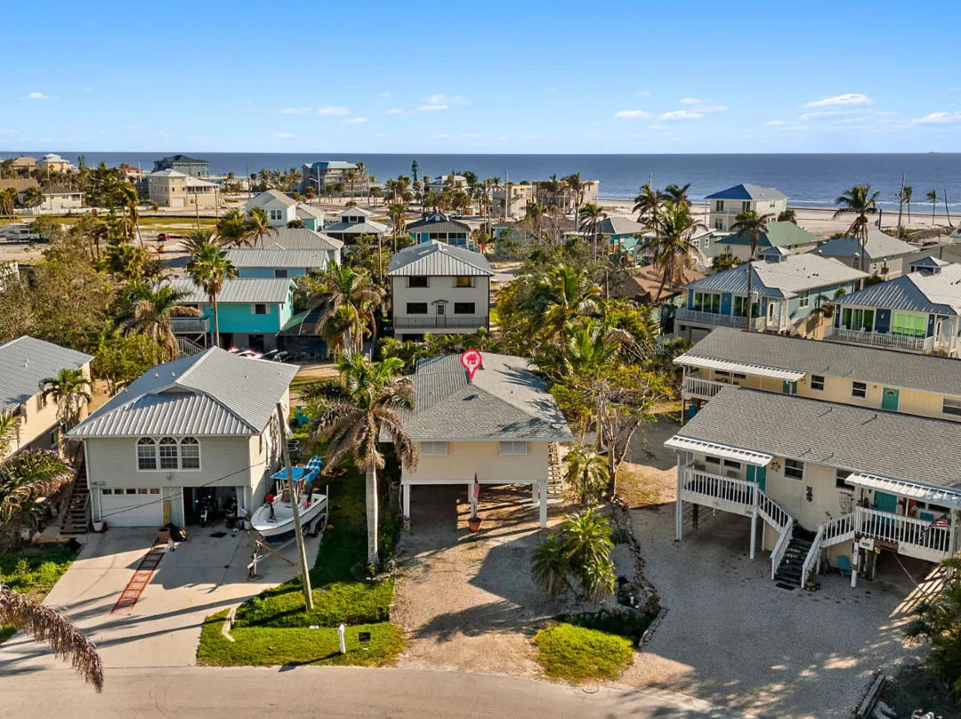 Stylish Outdoor Shower And Modern Kitchen - Cozy Beach Retreat - Fort Myers Beach, FL