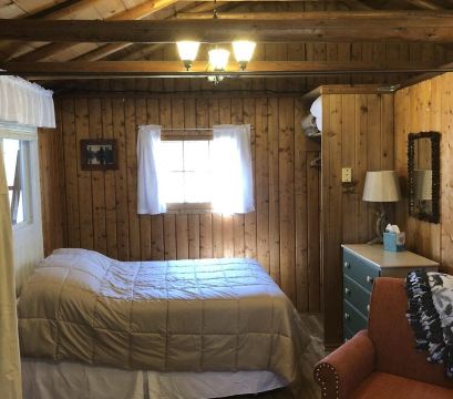Cozy "Up North" Cabin in the woods with Pentwater Lake frontage and ...