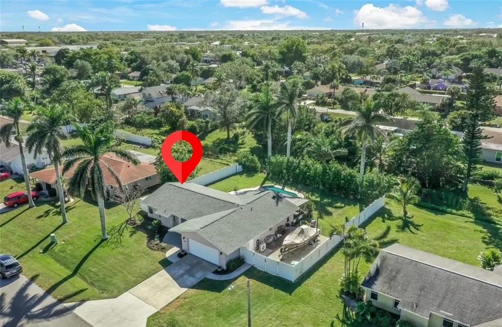 Backyard Pool And Outdoor Lounging Areas - Charming Oasis - Naples, FL