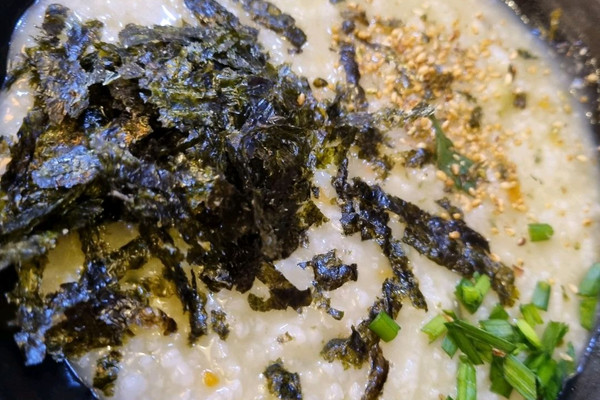 Abalone rice porridge with Army stew | Trip.com Seoul