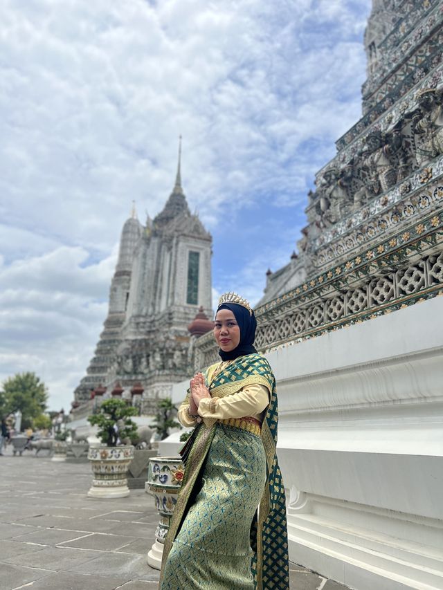 Using traditional clothes from in Wat Arun | Trip.com Bangkok
