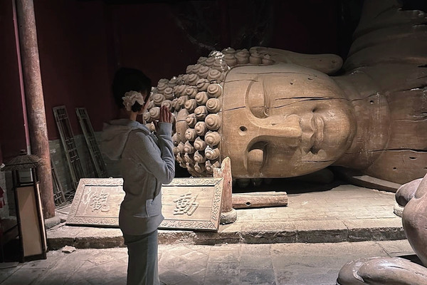 Beijing | The Buddha statue at Wangfujing Heping Guoju | Trip.com Beijing