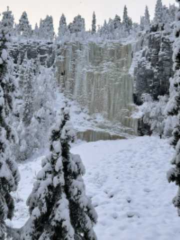 Diving into the nature of icy waterfall | Trip.com Eastern Lapland