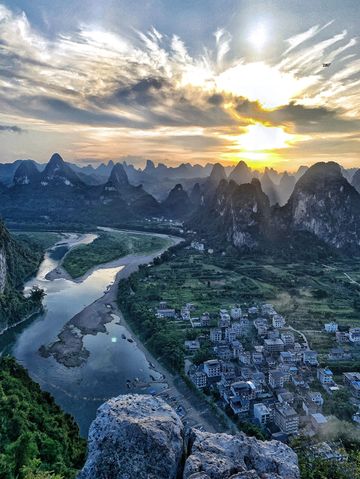 The beautiful sunrise and sunset of Laozhai Mountain in Yangshuo | Trip ...