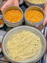 This bowl of crab roe noodles is absolutely top-notch! It's so ...