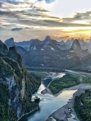 The beautiful sunrise and sunset of Laozhai Mountain in Yangshuo | Trip ...